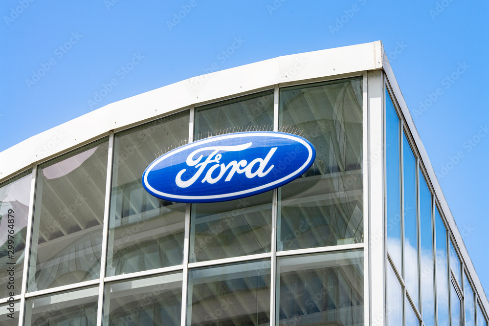 Logo of Ford at a car dealership Stock Photo | Adobe Stock