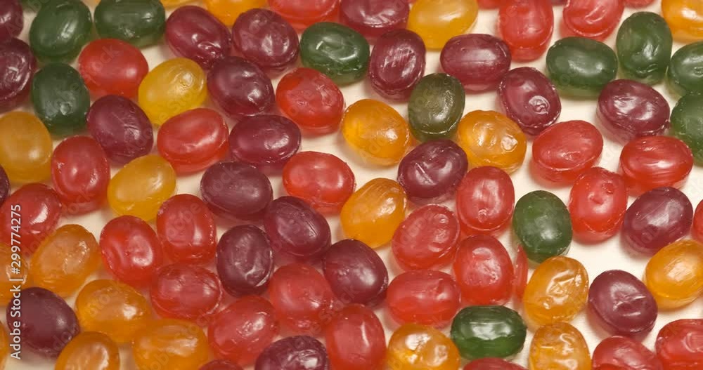 Video „Delicious sweets lies on white table, camera rotates clockwise ...