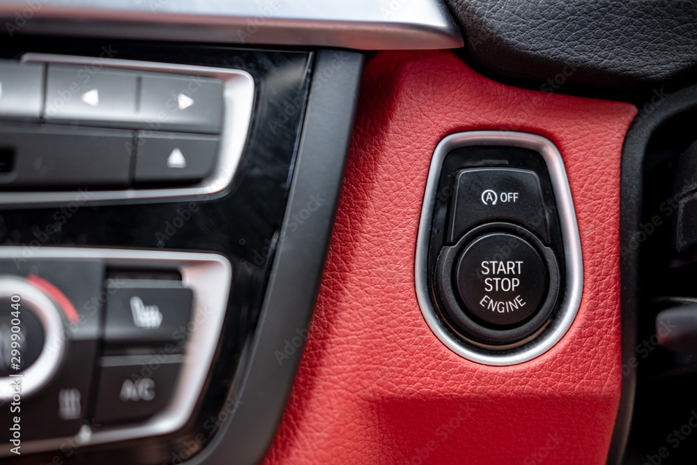 Poster Close-up, isolated image of an engine Start Stop button seen on ...