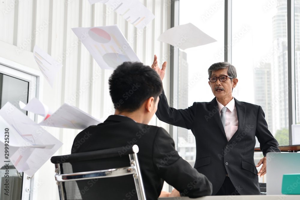 Angry boss throwing documents and yelling at employee Stock Photo ...
