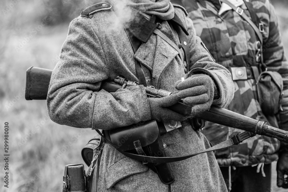 Poster German Wehrmacht soldier in overcoat with a rifle in his hands ...