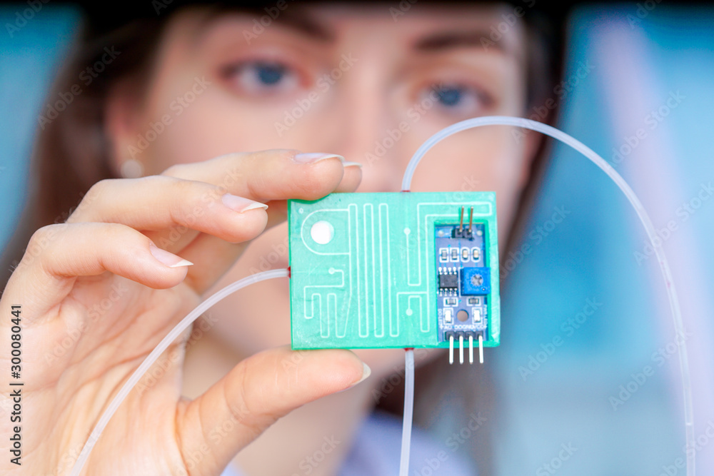 Girl holding polymers Bio-MEMS biomedical microelectromechanical ...