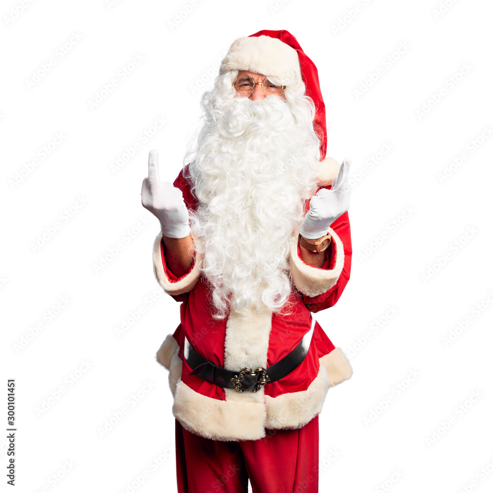 Middle age handsome man wearing Santa Claus costume and beard standing ...