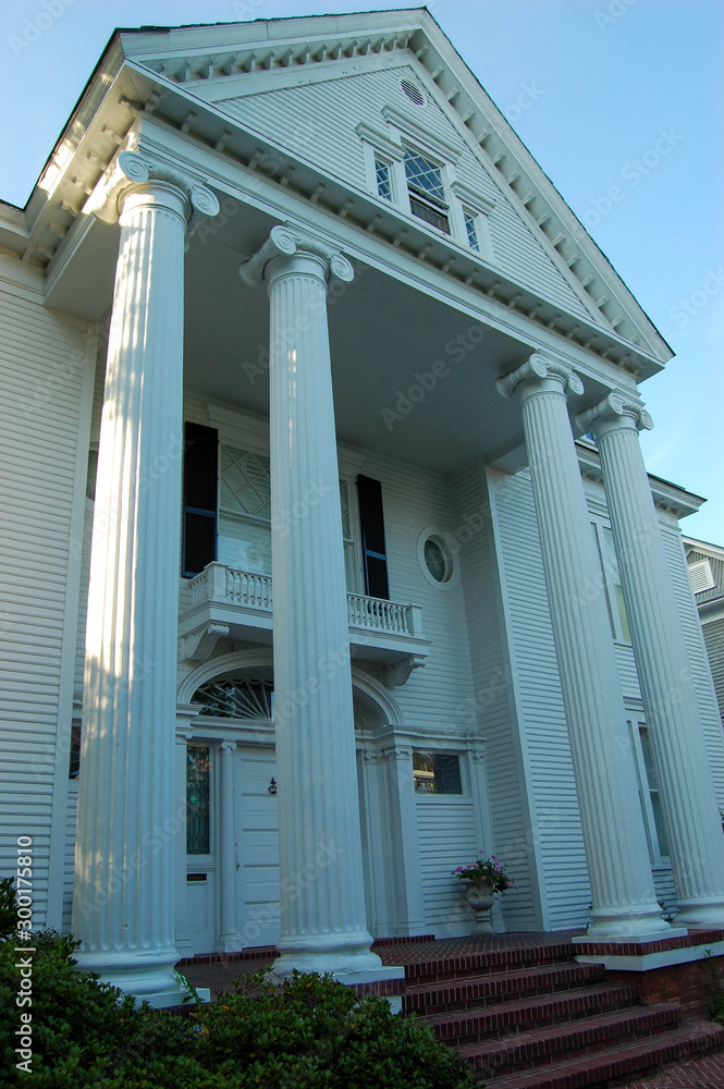Old plantation house with massive columns on the front porch. White ...