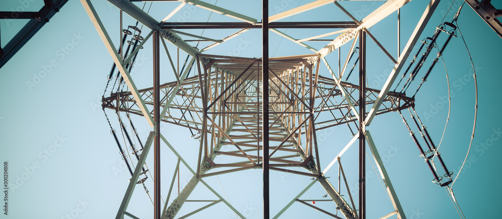 Close up of electrical tower and blue sky. Renewable energy and smart ...