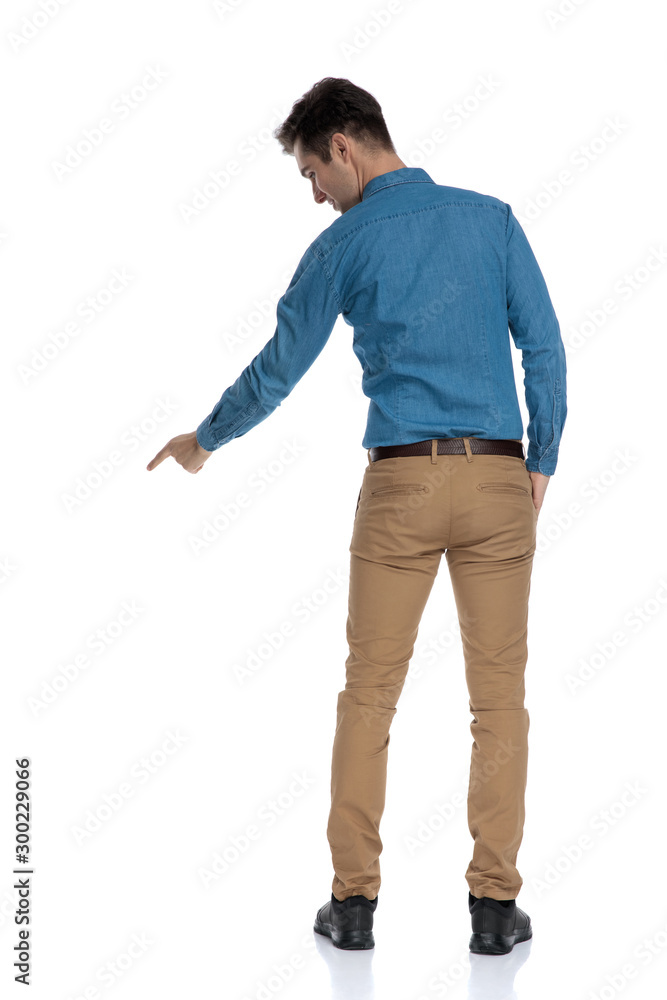 back view of smart casual man pointing finger down Stock Photo | Adobe ...
