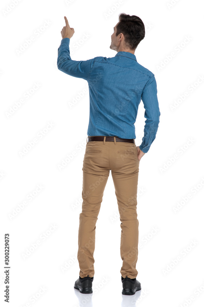 back view of smart casual man looking up and pointing finger Stock ...