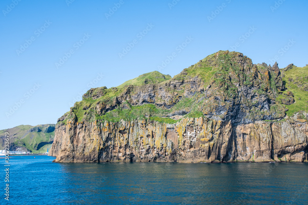 Cliffs of island of Heimaey in Vetmannaeyjar island group in Iceland ...