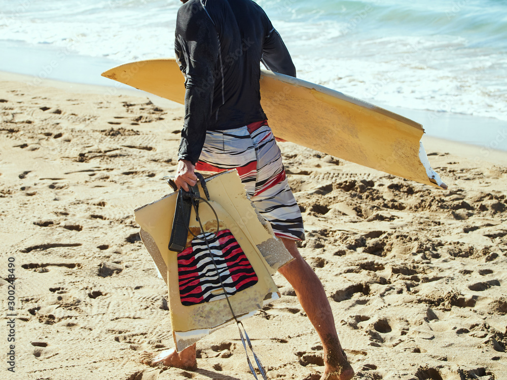 Broken Surfboard By Beach