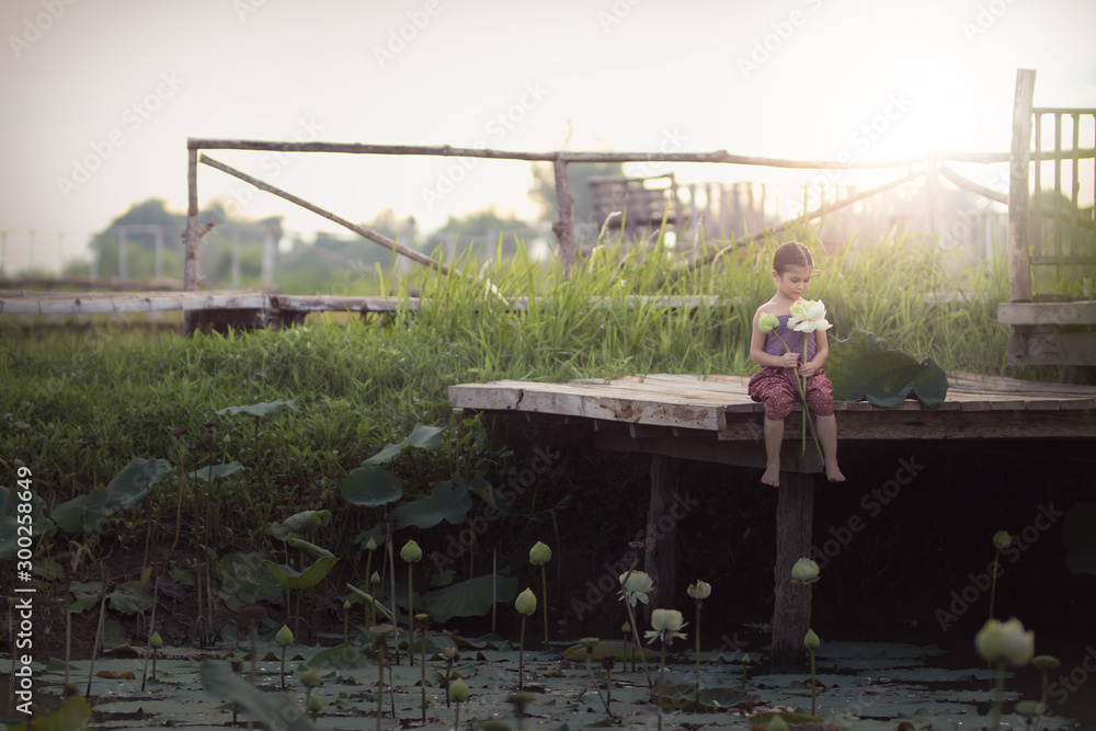little foreigner girl in Thai costume playing,posing with fun and happy ...