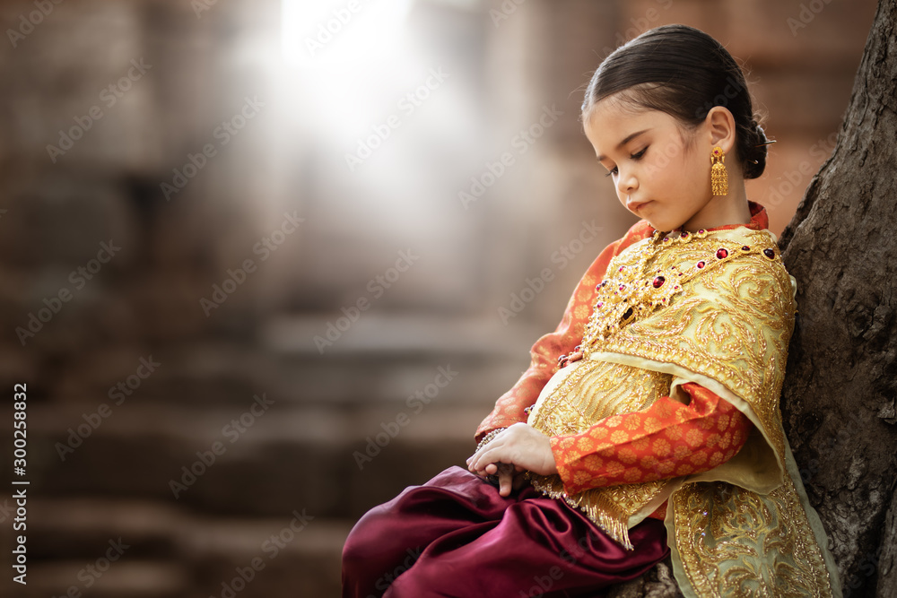 little foreigner girl in Thai costume playing,posing with fun and happy ...