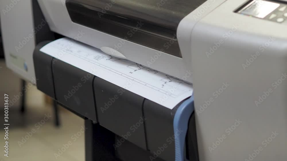 Static shot of Wide format printer, plotter is printing design draft ...