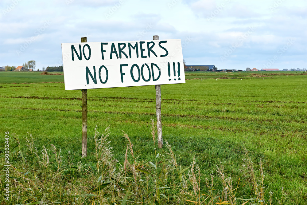 Sign in agricultural field with text No Farmers No Food. Farmers in the ...