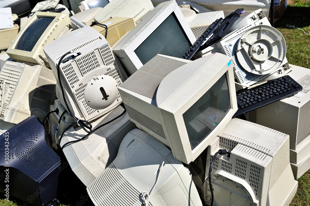 Pile of old computer monitors and keyboards Stock Photo | Adobe Stock