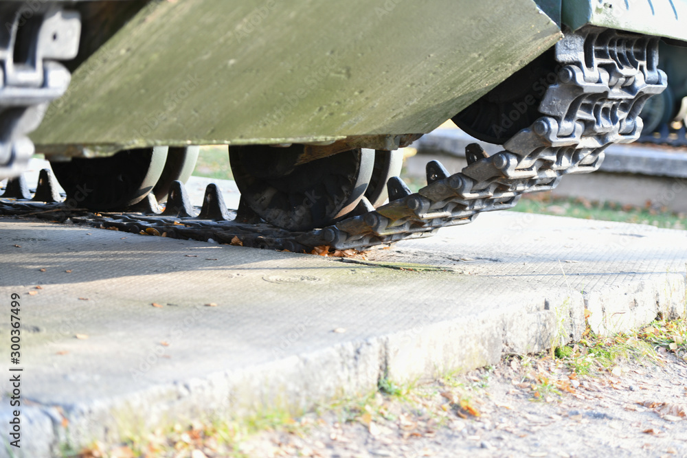 Tank wheels close-up. Iron tracks of a heavy military tank. Iron ...