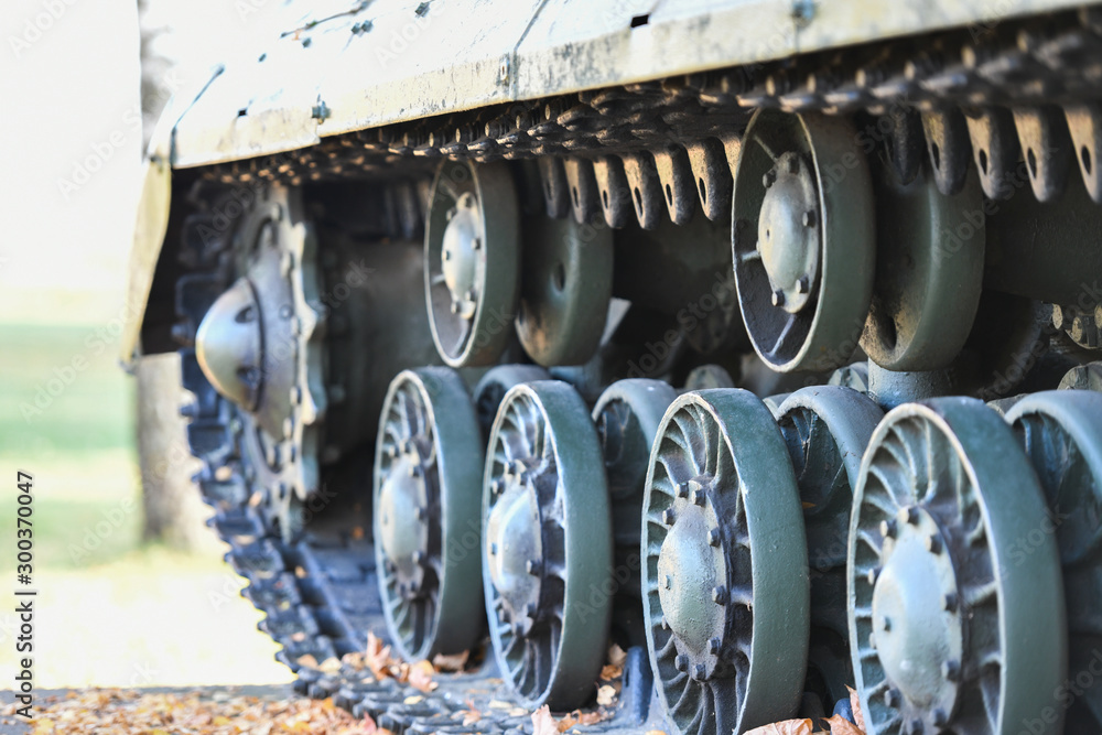 Tank wheels close-up. Iron tracks of a heavy military tank. Iron ...