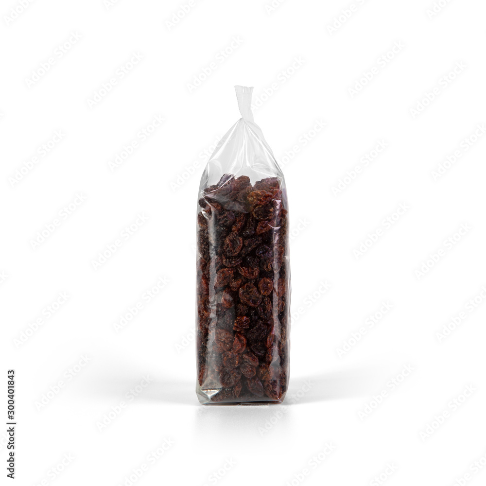 Raisins in transparent plastic bag isolated on white background ...