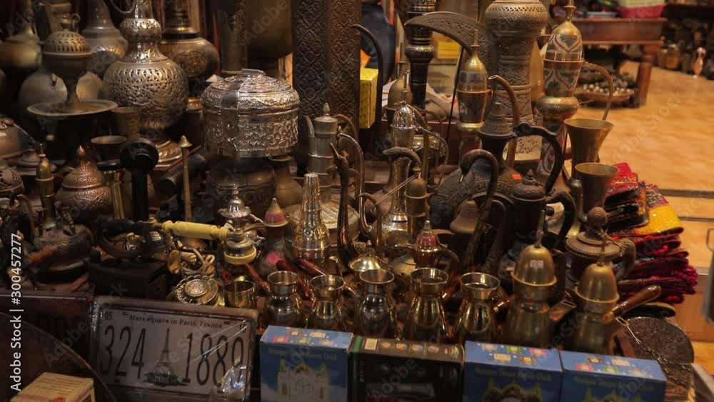 Traditional oriental souvenirs. Coated vases and coffee pots. Multi ...