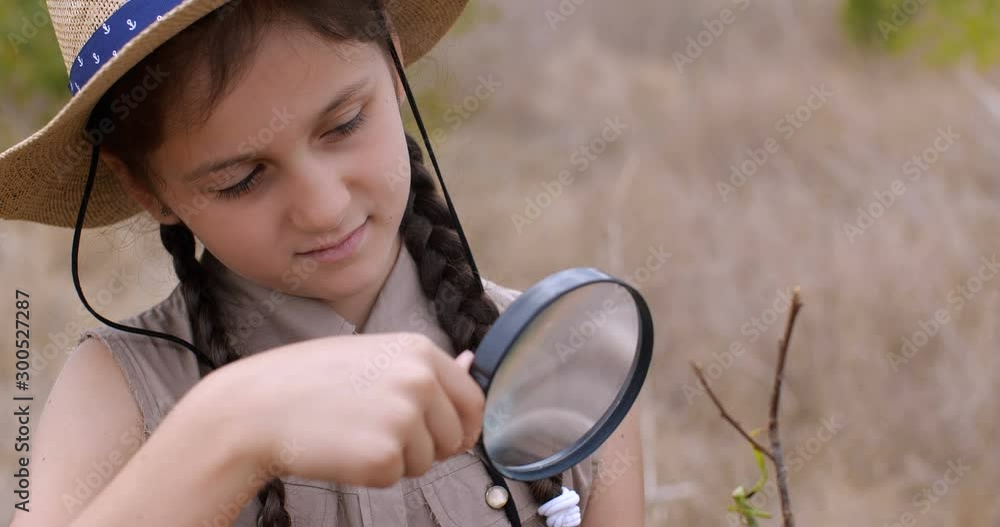 Children exploring world. Little girl of seven years old in straw hat ...