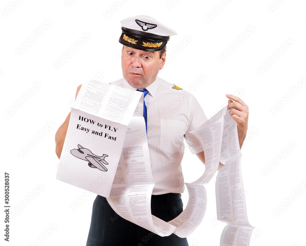 The pilot looks into instructions about using the aircraft, isolated on ...