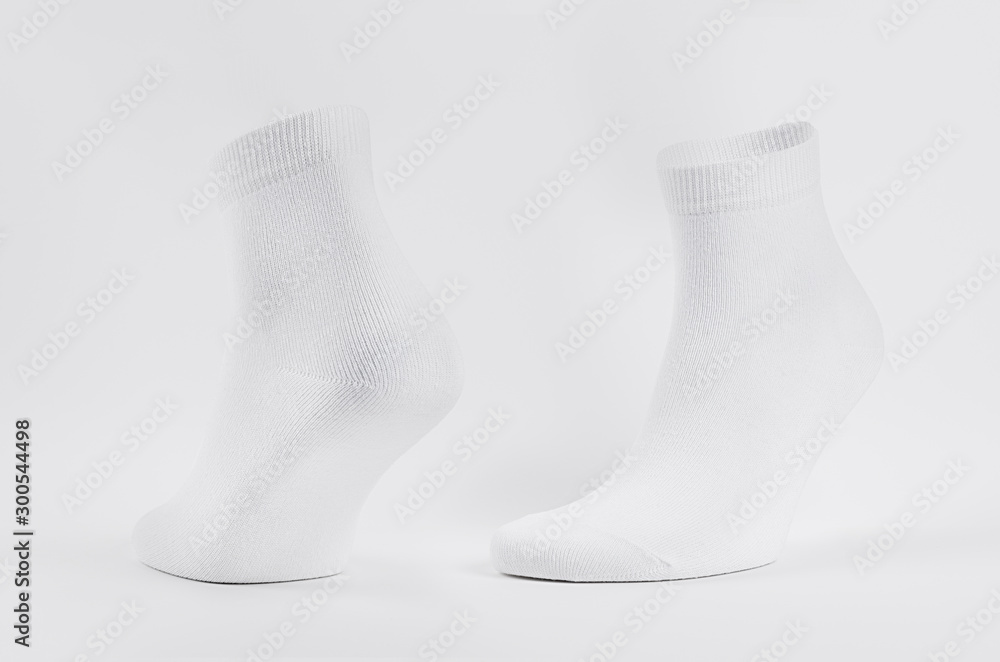 Blank white cotton medium sock on invisible foot on white background as ...
