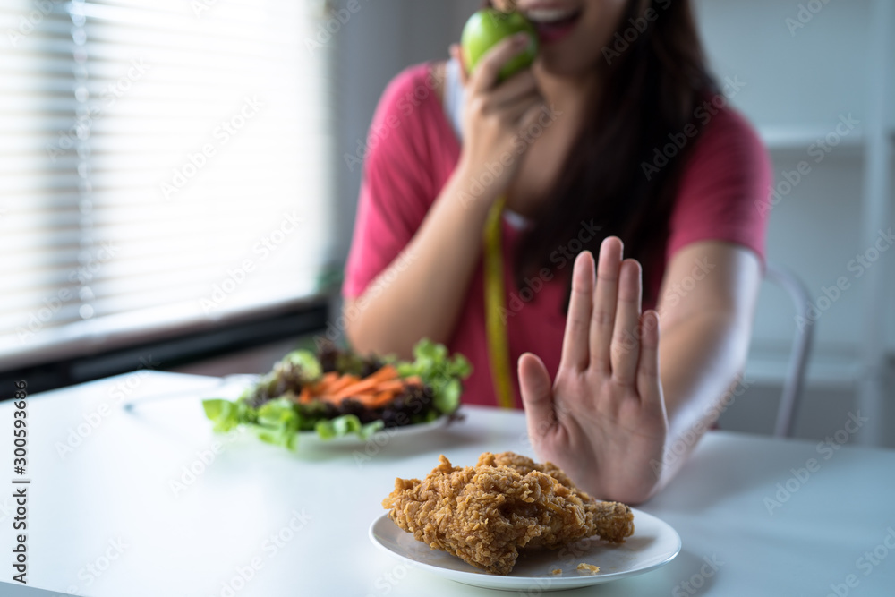 Good health concept, women refuse fried chicken as junk food and choose ...