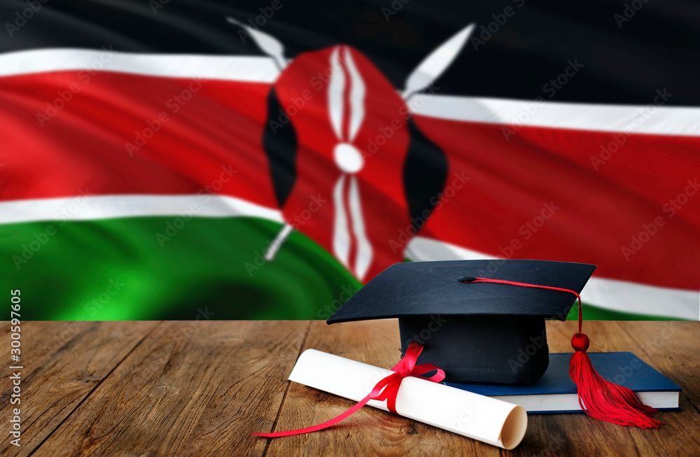Kenya education concept. Graduation cap and diploma on wooden table ...