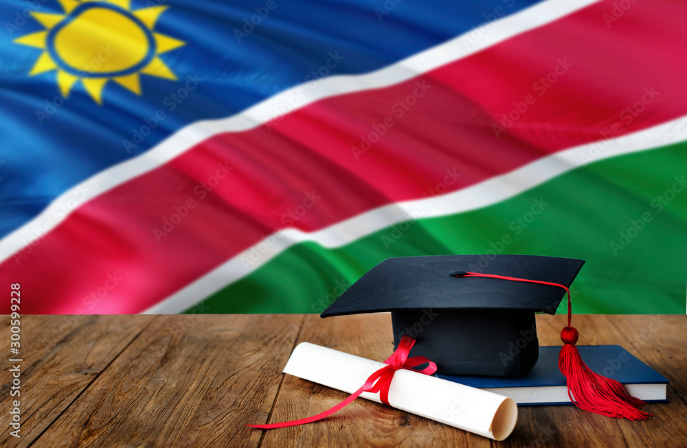 Namibia education concept. Graduation cap and diploma on wooden table ...