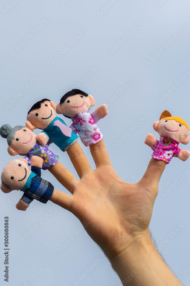 family finger puppet theater. child hand with finger puppets: son ...