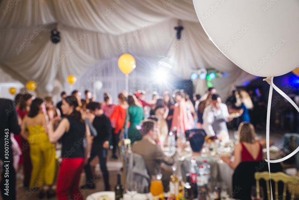 Group of cheerful friends having a party in the city throwing confetti ...