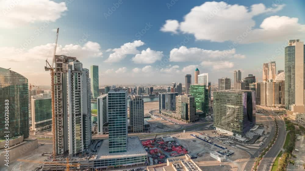 Dubai's business bay towers at morning aerial timelapse. Rooftop view ...