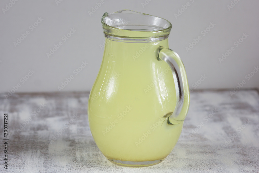 Liquid whey that remains after formation of curds in jar on white ...