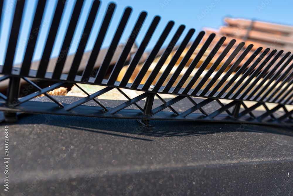 Eaves comb with ventilation grille mounted on the newly built roof ...