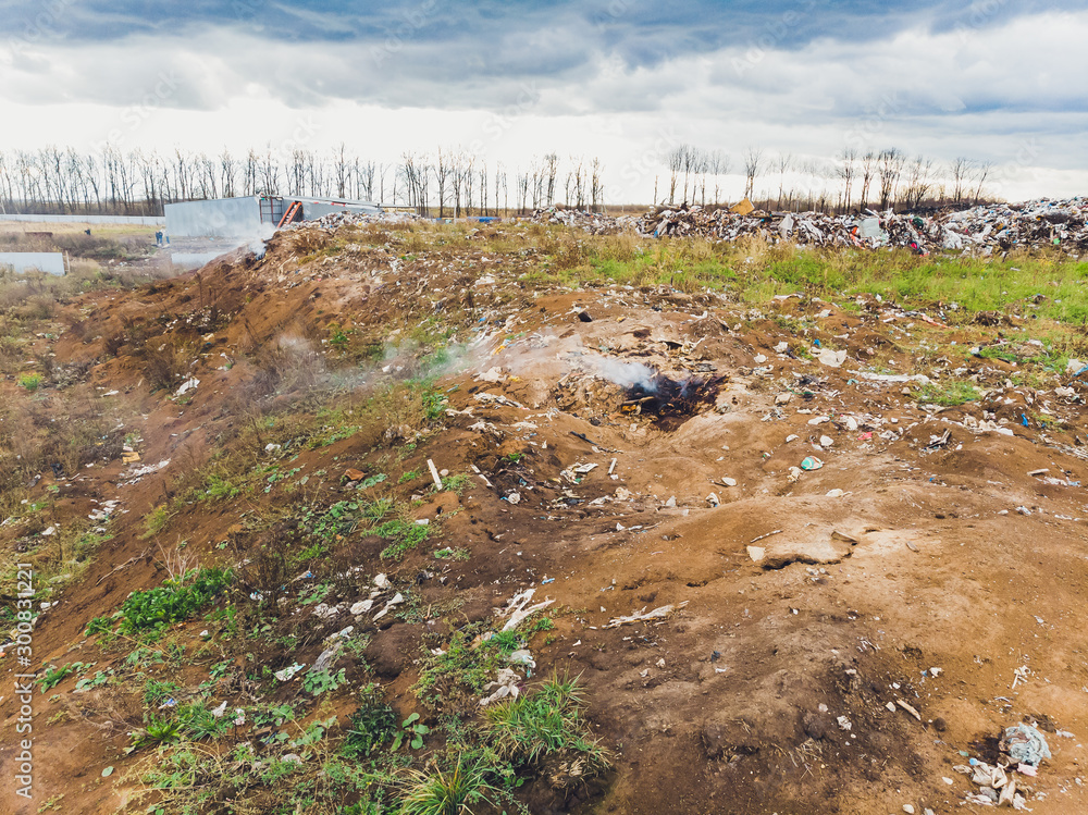 The large heap garbage dump extends parallel to the river,Garbage ...