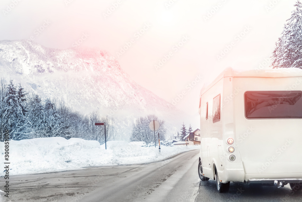 Caravan or campervan turning from road with beautiful mountain alpine ...