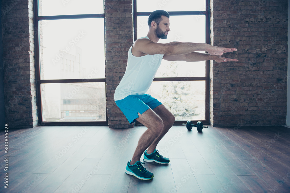 Full length profile photo of macho guy doing static squats fat burning ...