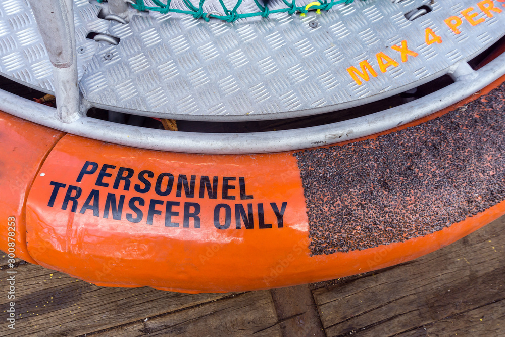 Marking on a personal transfer basket with wording 'PERSONNEL TRANSFER ...