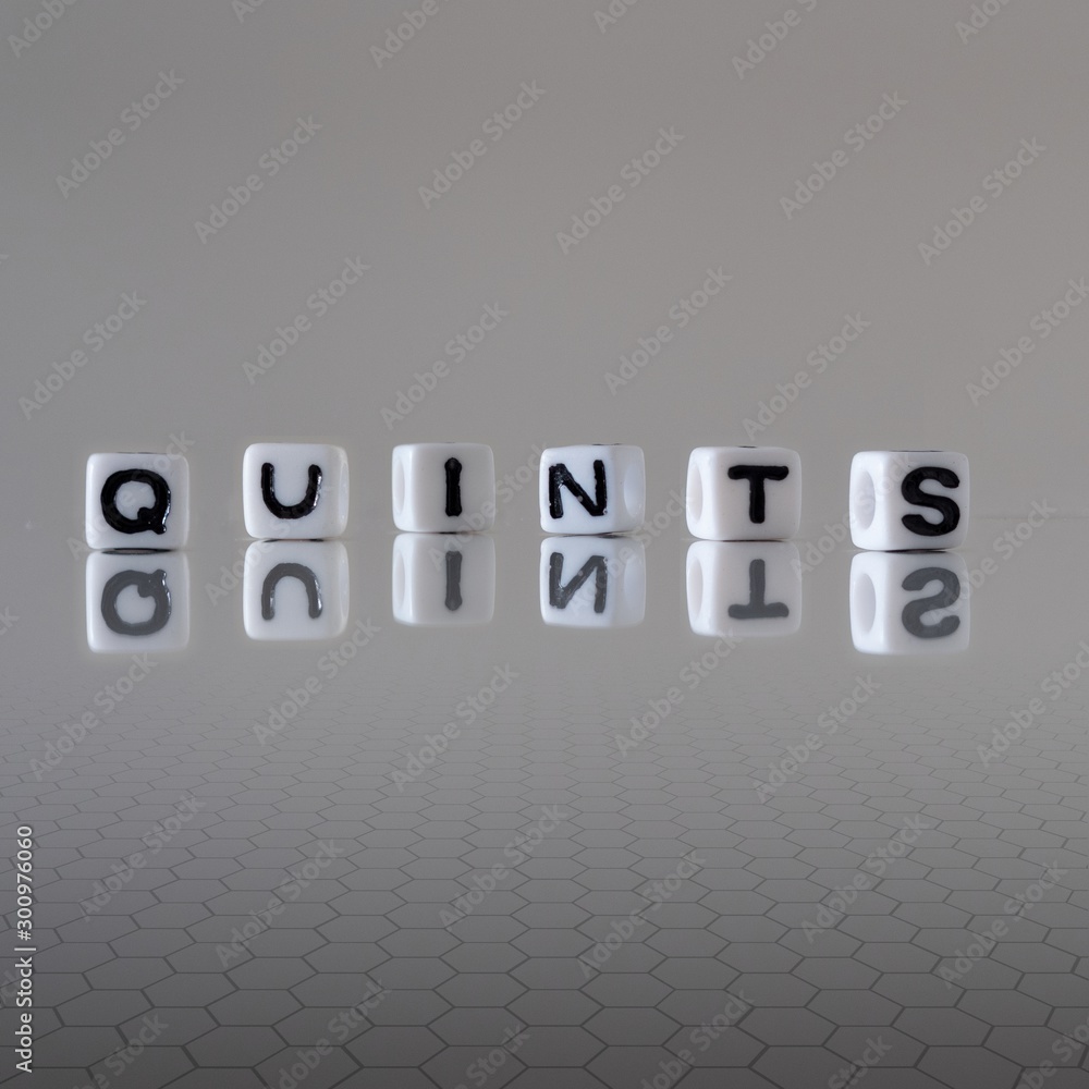 The concept of quints represented by wooden letter tiles Stock Photo ...