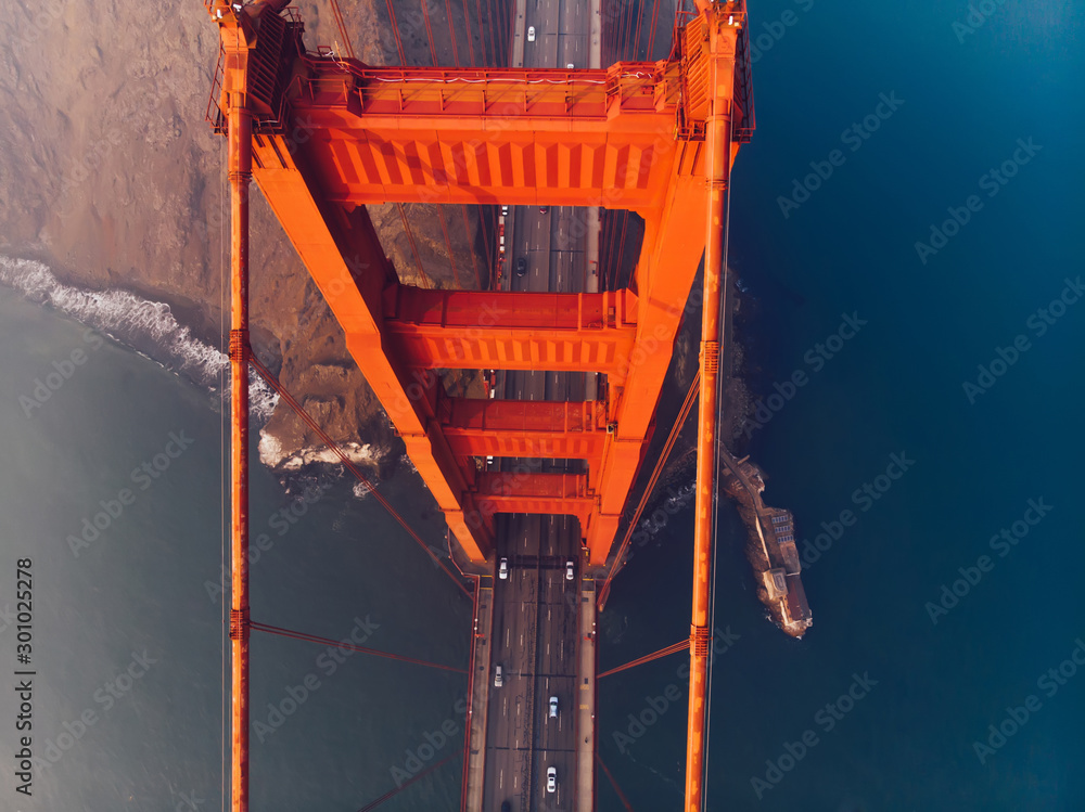 Aerial top view of Golden Gate Bridge with highway, metropolitan ...