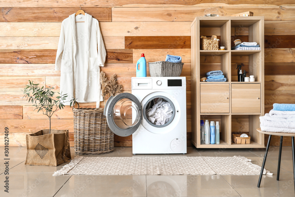 Interior of home laundry room with modern washing machine Stock Photo ...