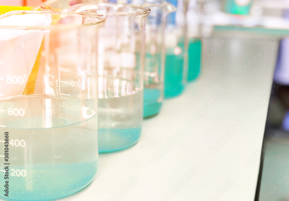 Waste water sample in beakers coagulation and flocculation method with ...