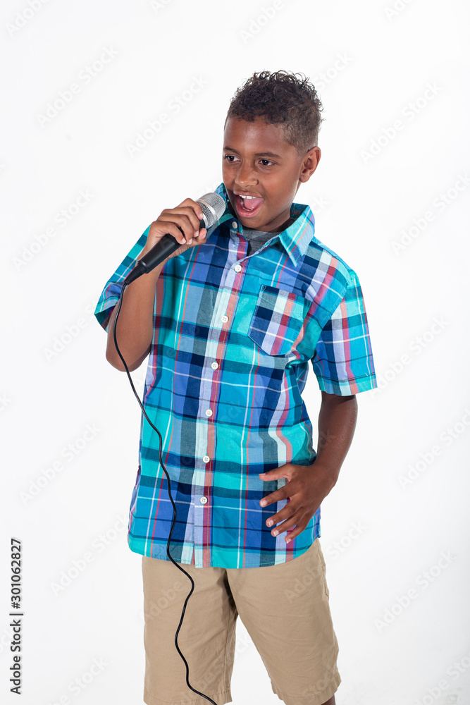 Talented young diverse singer singing into a microphone. Cute African ...