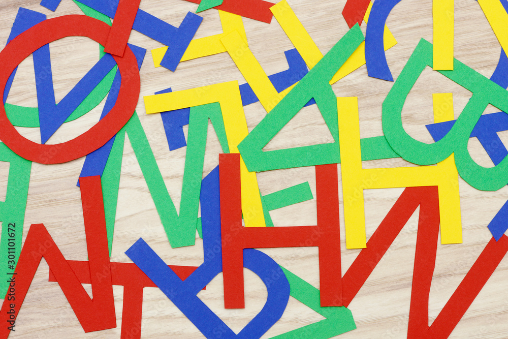 colorful jumbled letters, made of paper, lying on wood Stock Photo ...