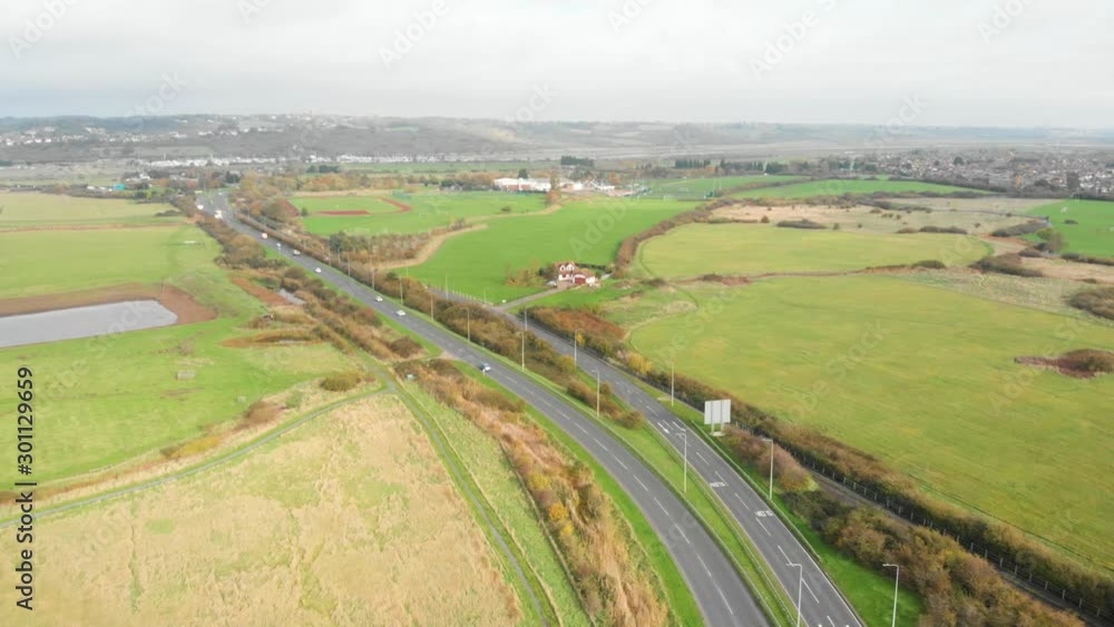 Aerial of a main road with hills in the background Stock Video | Adobe ...
