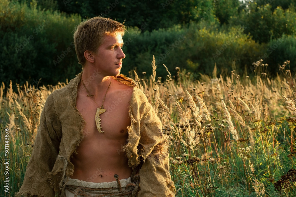 Downshifting concept - medieval peasant in a ragged clothes ...