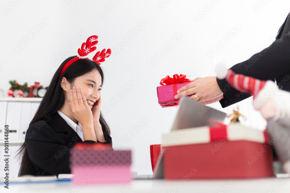 hand of boss send gift box to officer, attractive asian female use hand ...