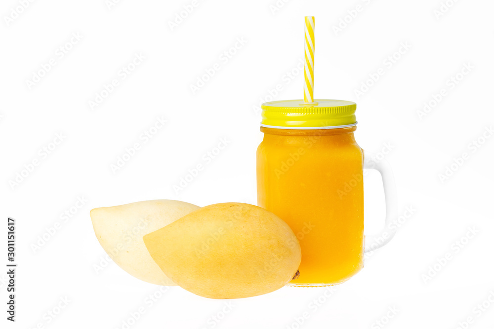 Closeup yellow jar of mango shake with a straw in a cap and two single ...