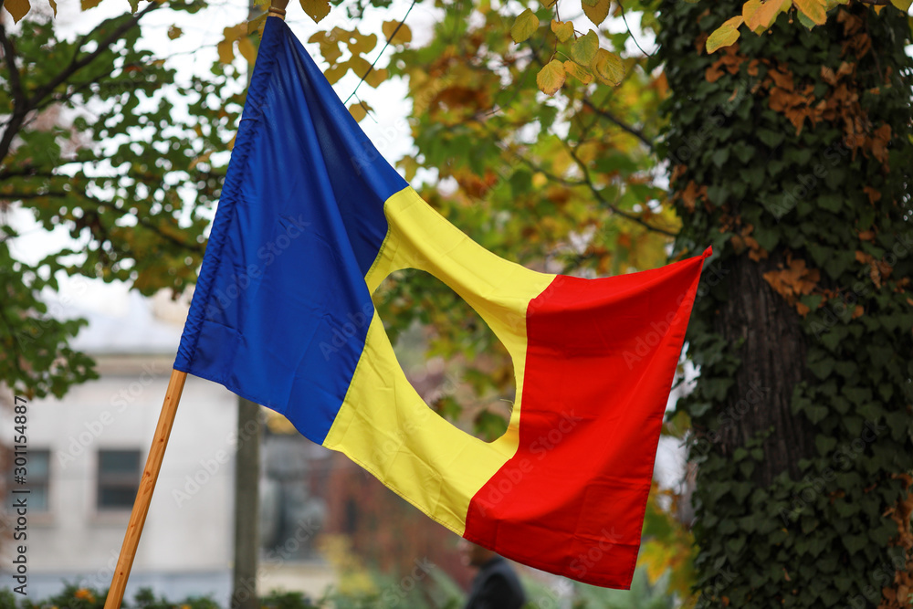 Details with the Romanian flag with a hole, the symbol of the Romanian ...
