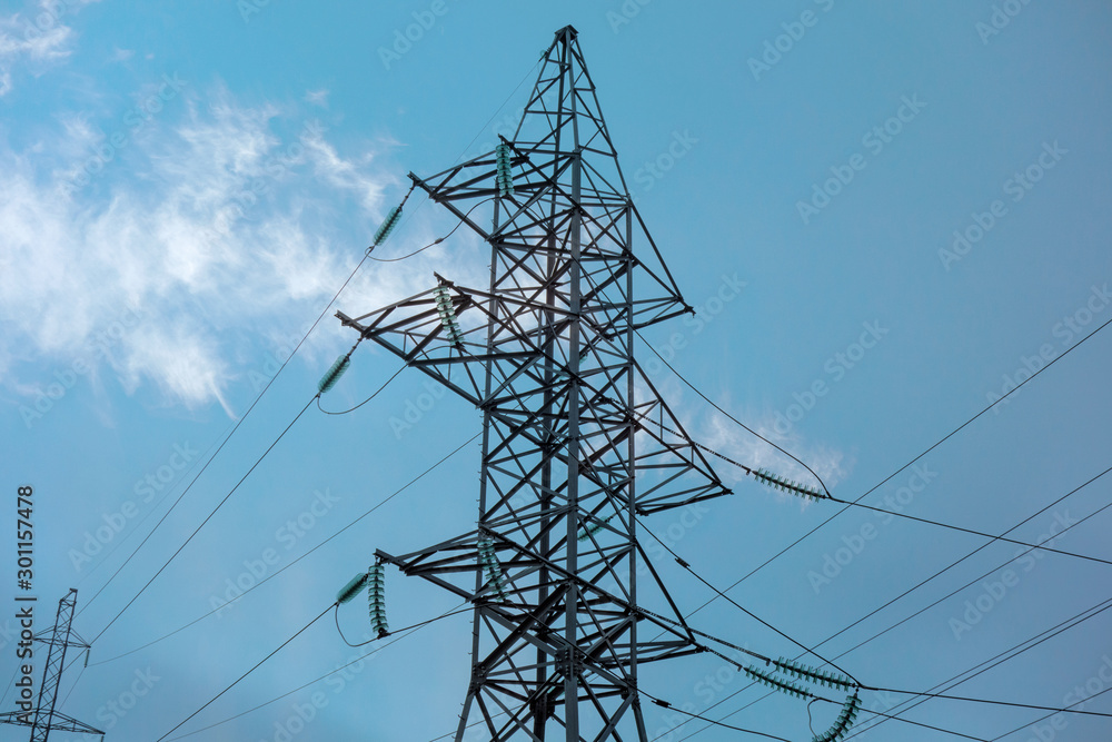 Electric transmission line tower with insulators and conductors ...