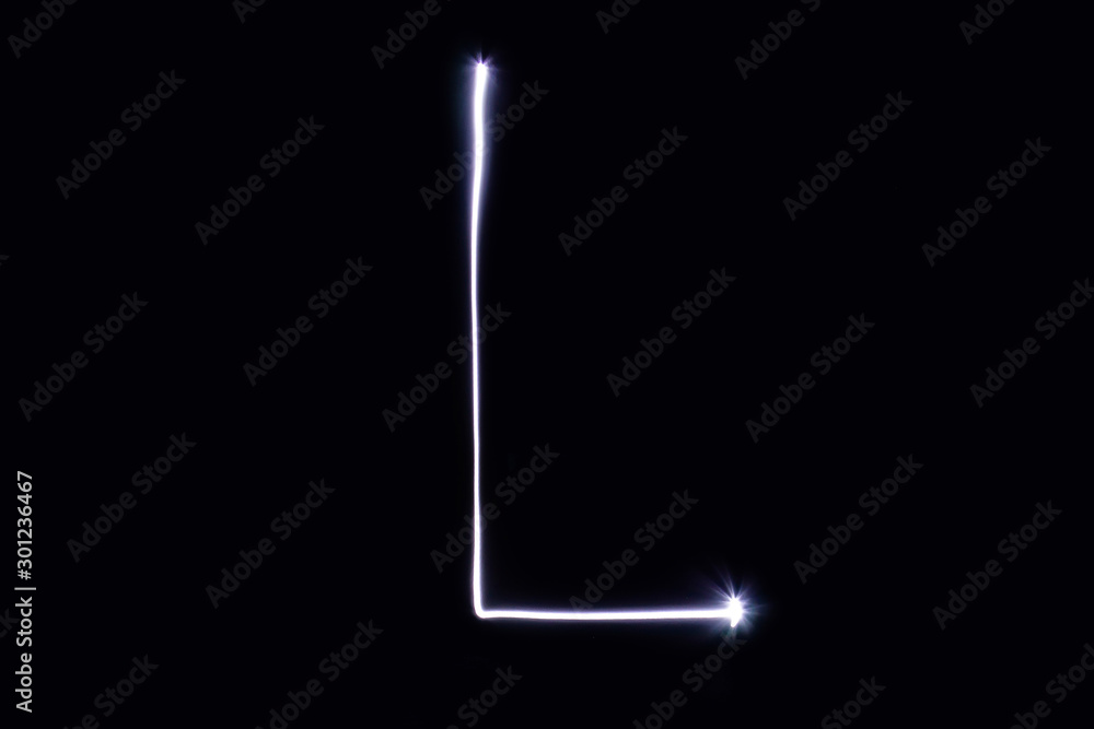 Alphabet made of neon light on a black background. Isolated top view ...